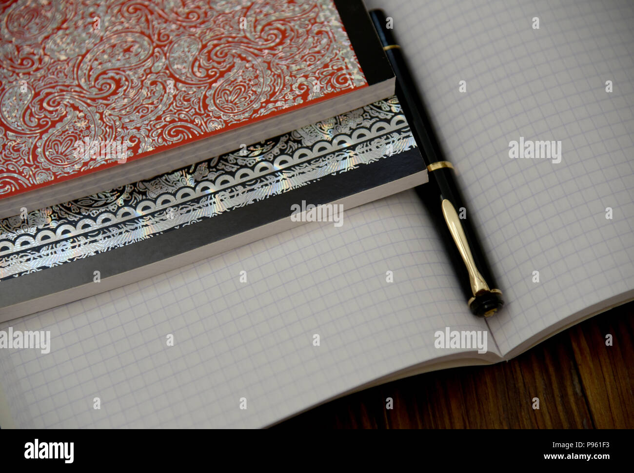 notebook and feather style Stock Photo - Alamy