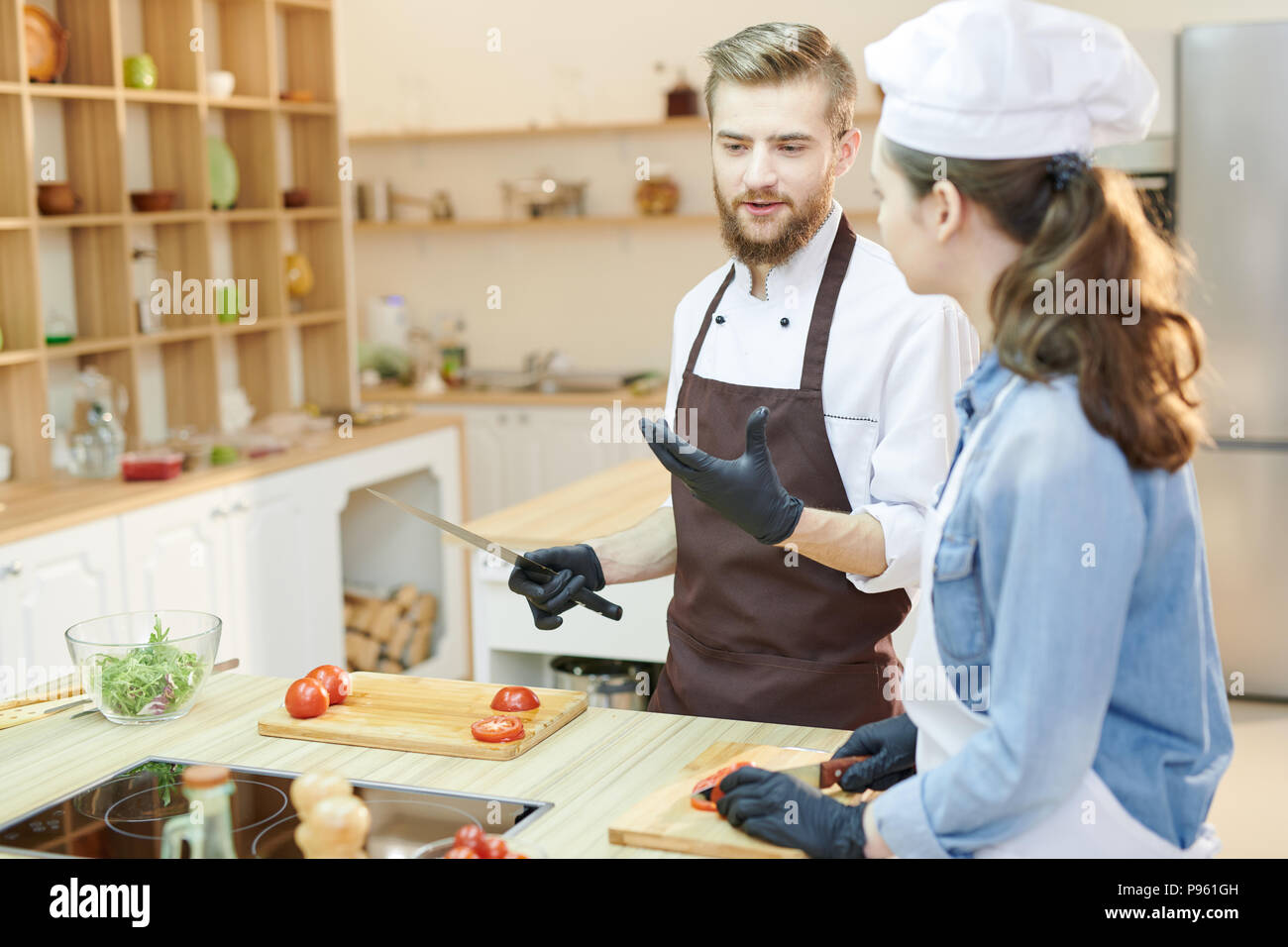Two Professional Chefs Cooking in Cafe Stock Photo - Alamy