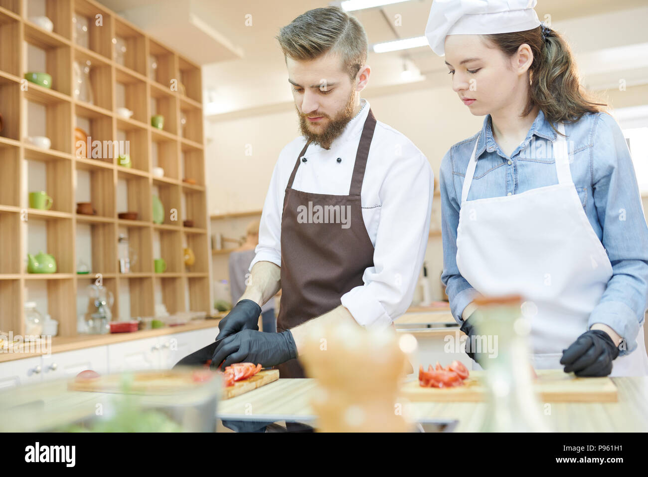 Two Professional Chefs Cooking in Restaurant Stock Photo - Alamy