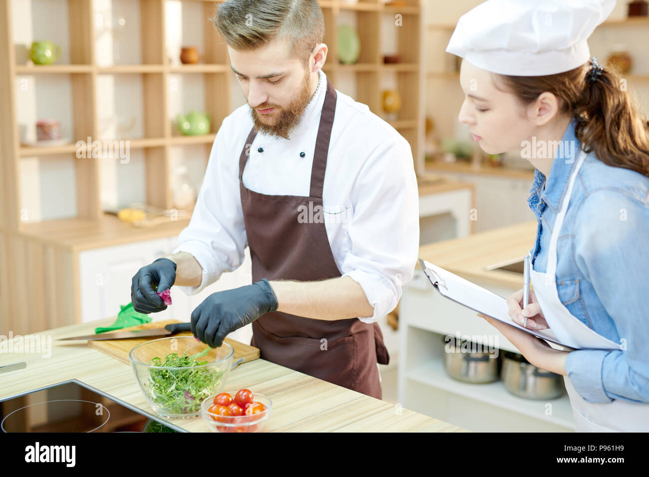 Young Chef Working in Restaurant Kitchen Stock Photo - Alamy