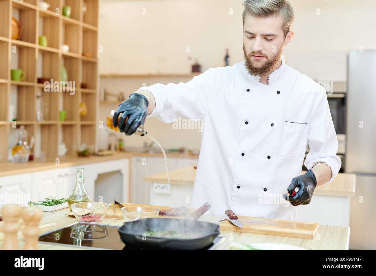 Handsome Chef Cooking in Restaurant Stock Photo - Alamy