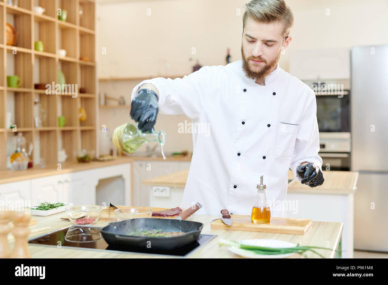 Handsome Chef Cooking in Cafe Stock Photo - Alamy