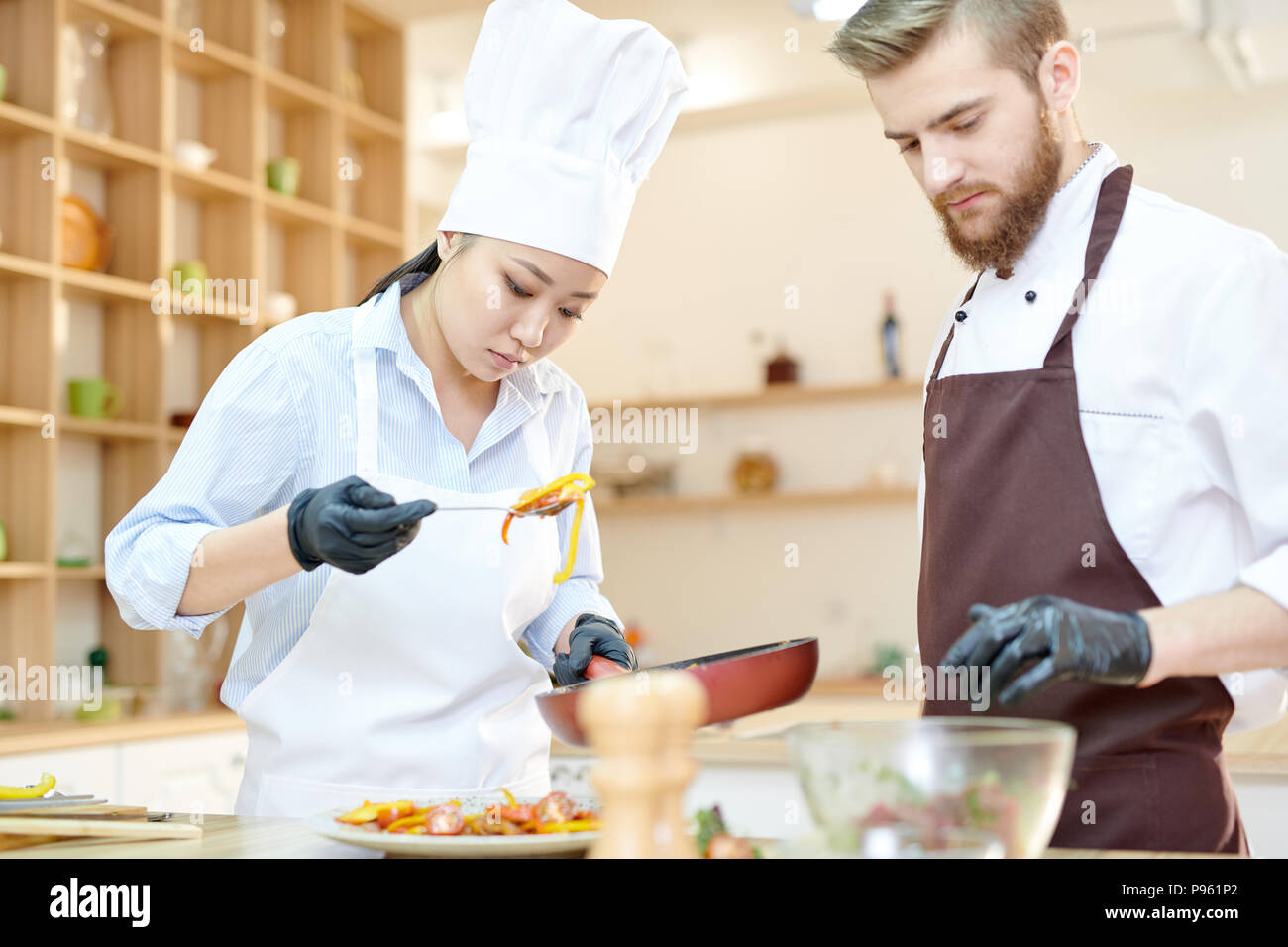 In his kitchen with his assistant chefs hi-res stock photography and ...