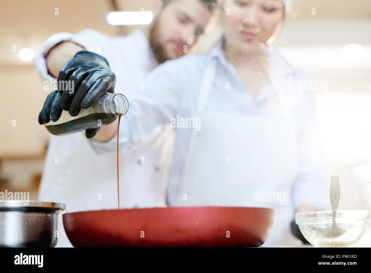 Two Chefs Pouring Soy Sauce Stock Photo - Alamy