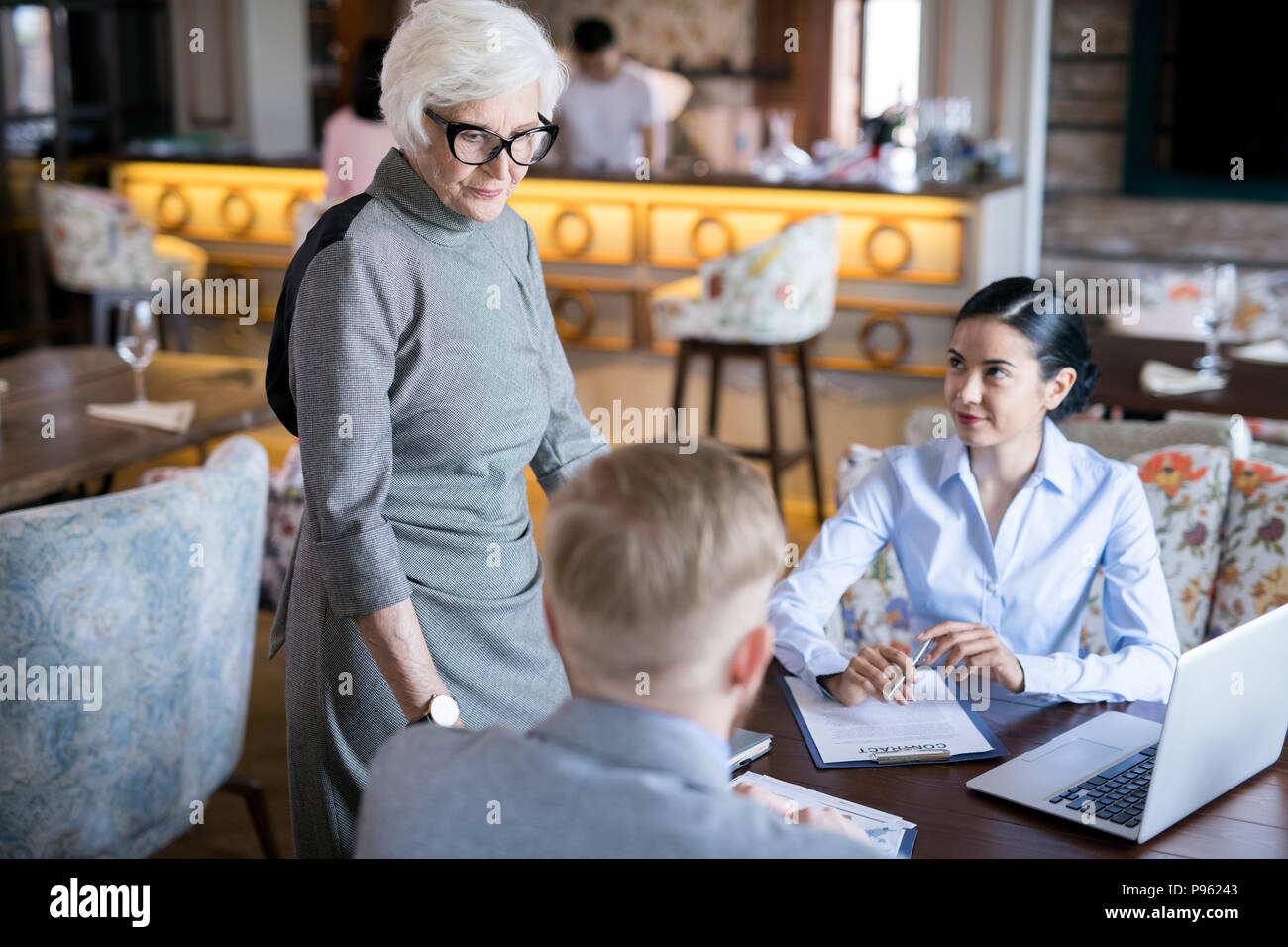 Senior leader watching work process Stock Photo - Alamy