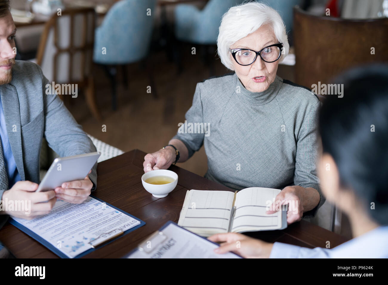 Female leader gives orders Stock Photo - Alamy
