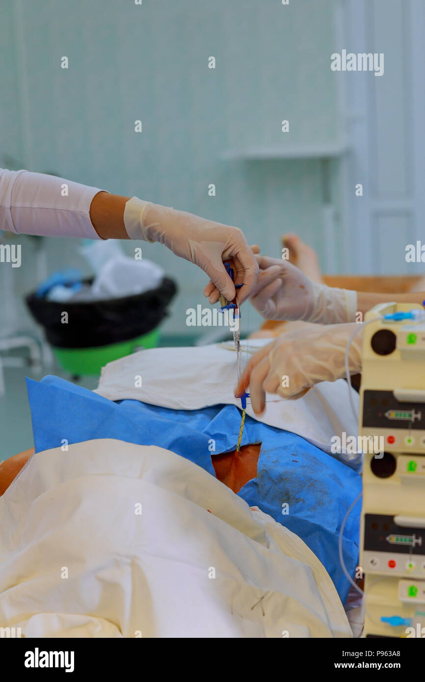 Surgeons team preforming operation in hospital operating, central ...