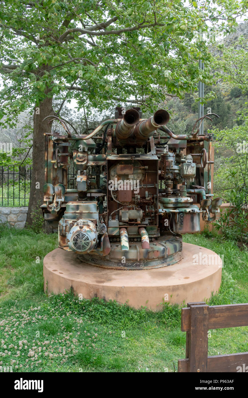 A vintage WWII anti-aircraft gun in the mountain village of Therisso on ...