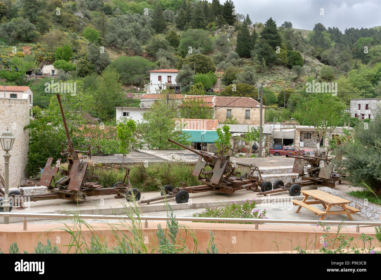A vintage WWII anti-aircraft gun in the mountain village of Therisso on ...