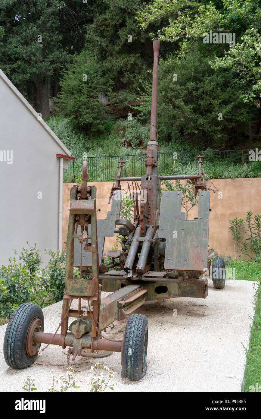 A vintage WWII anti-aircraft gun in the mountain village of Therisso on ...