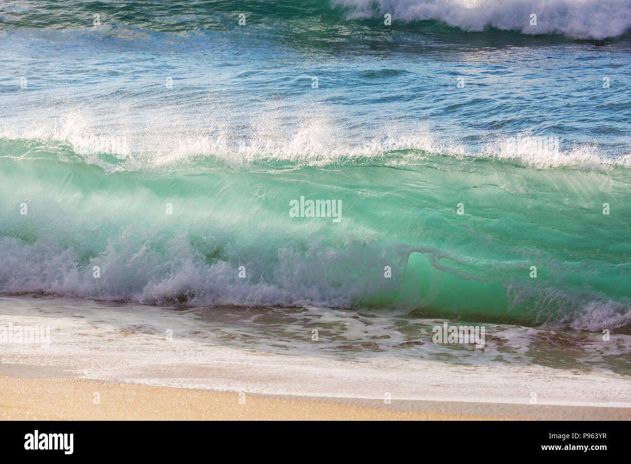 Blue wave on the beach. Blur background and sunlight spots. Peaceful ...