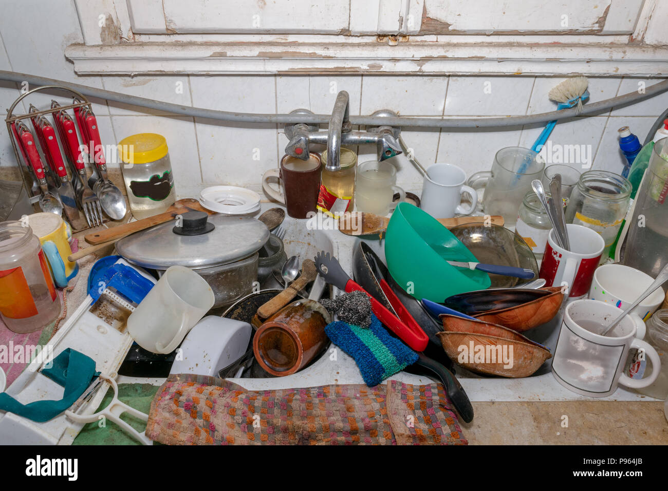 Pile of dirty utensils in a kitchen washbasin Stock Photo - Alamy