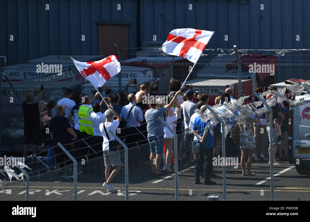 Fans await the arrival of the England team at Birmingham Airport as the ...