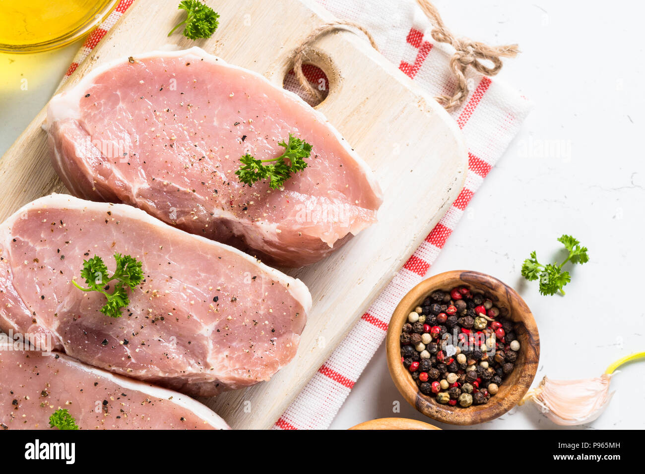 Pork meat steak, slices pork loin on white. Top view with copy space ...
