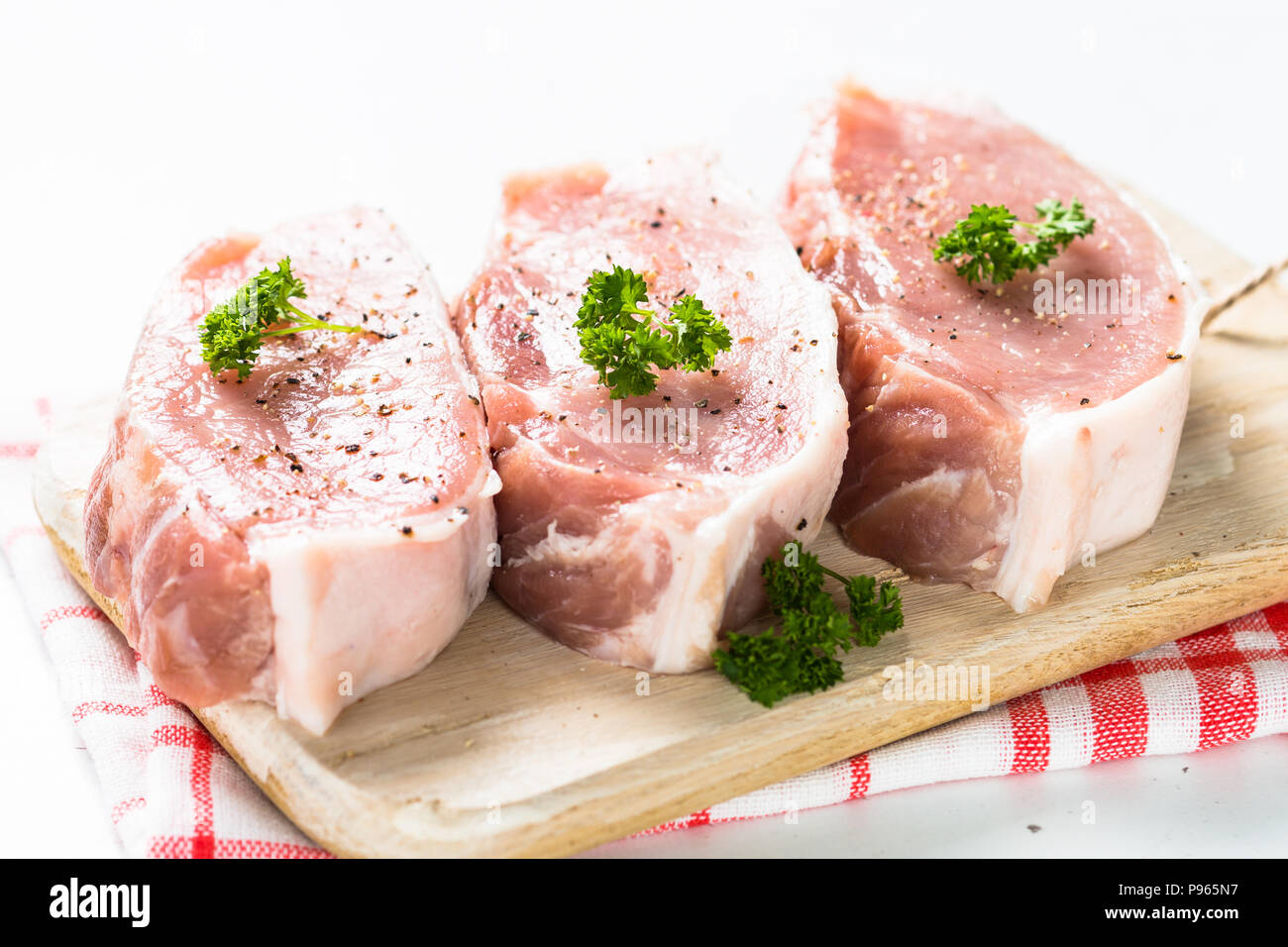 Pork meat steak, slices pork loin on white isolated Stock Photo - Alamy