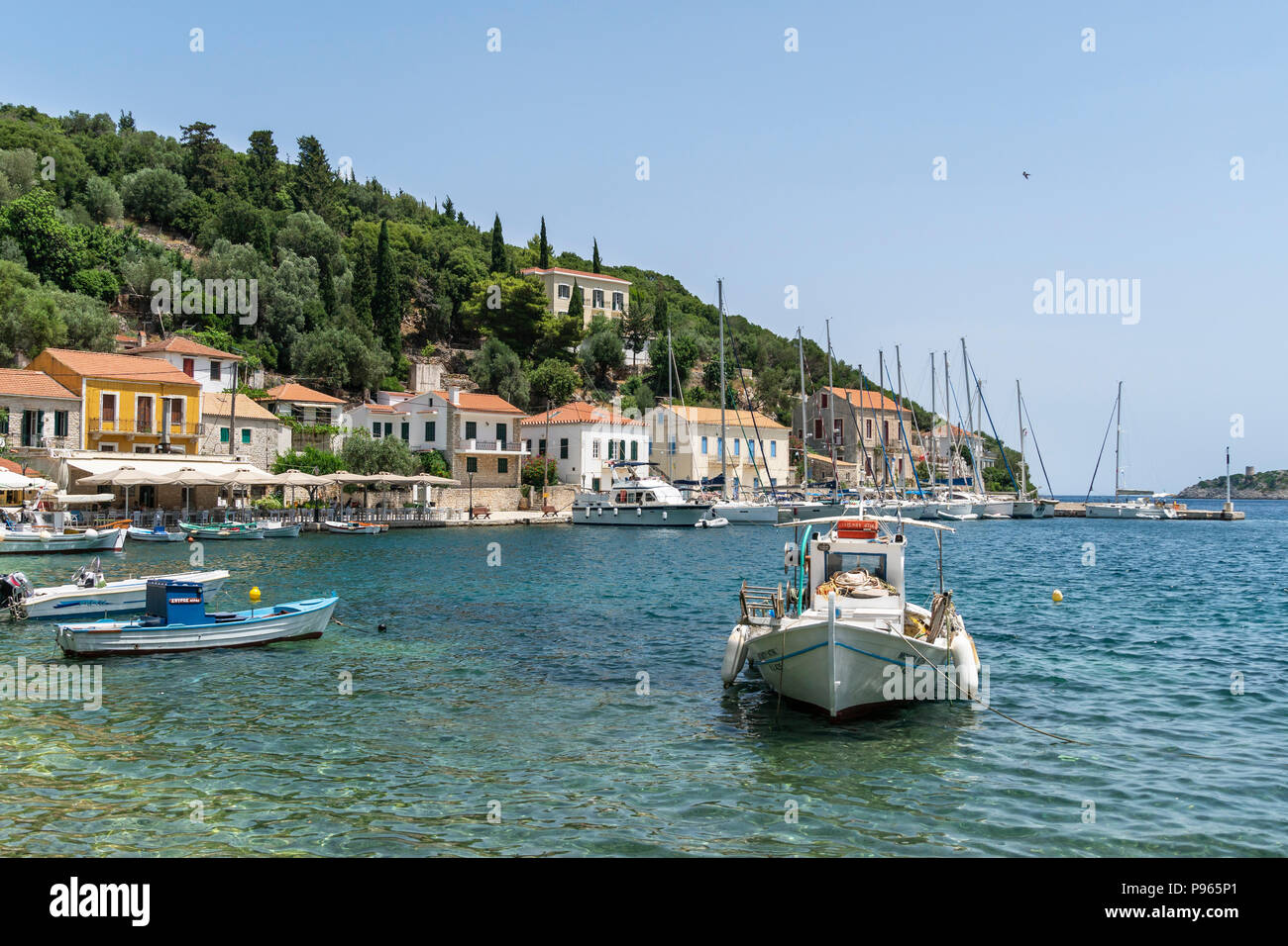 Fishing boats in the harbour at the village of Kioni on the north ...