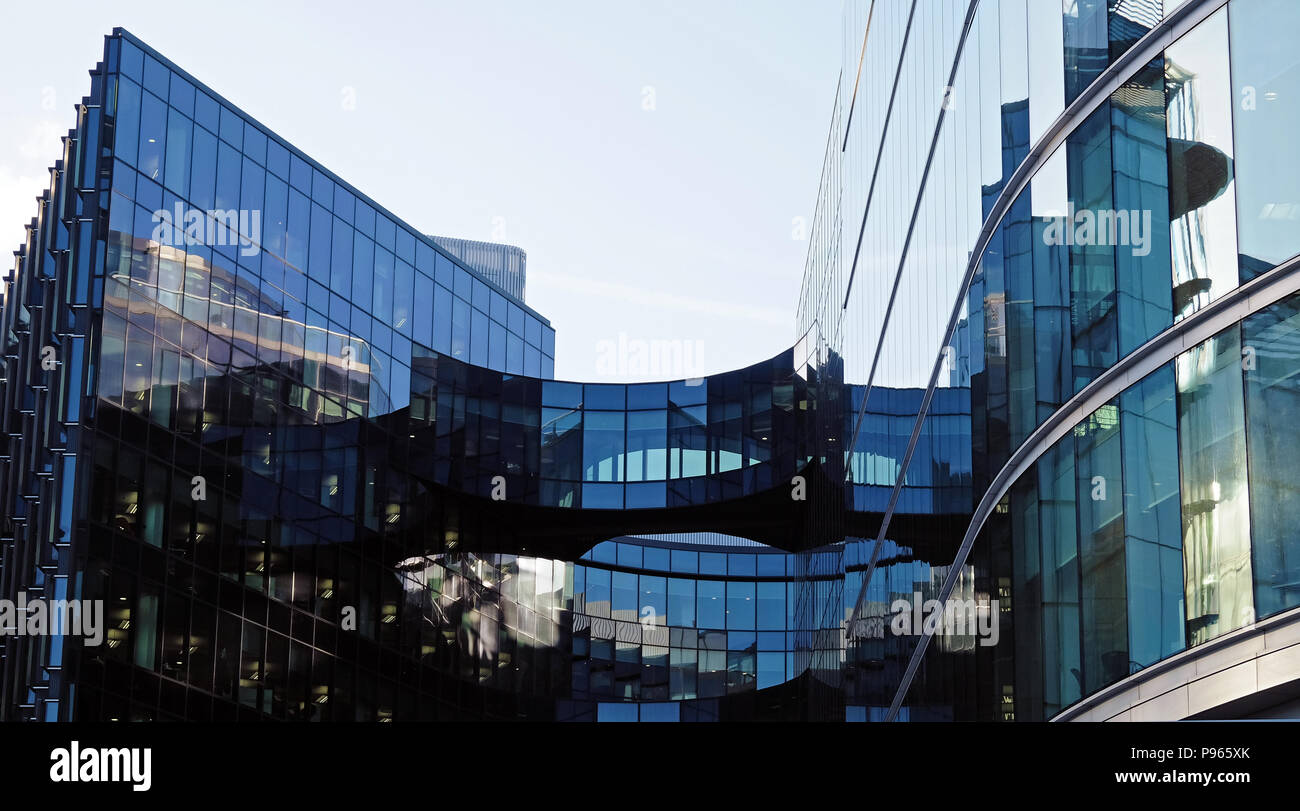 Reflective modern glass office buildings at London Bridge City, Thames ...
