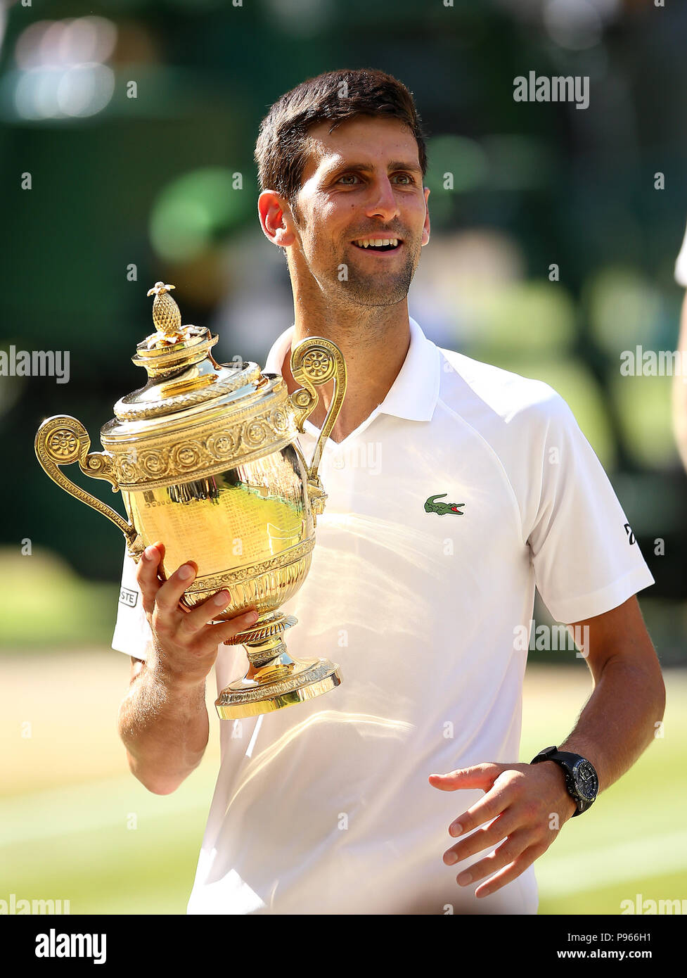 Novak Djokovic with the trophy after winning the Gentlemen's Singles ...