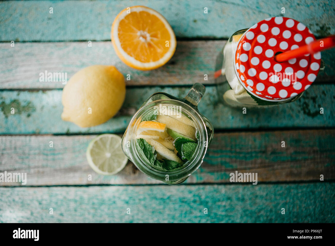 Homemade citrus lemonade or juice or mojito in a jar on a wooden ...