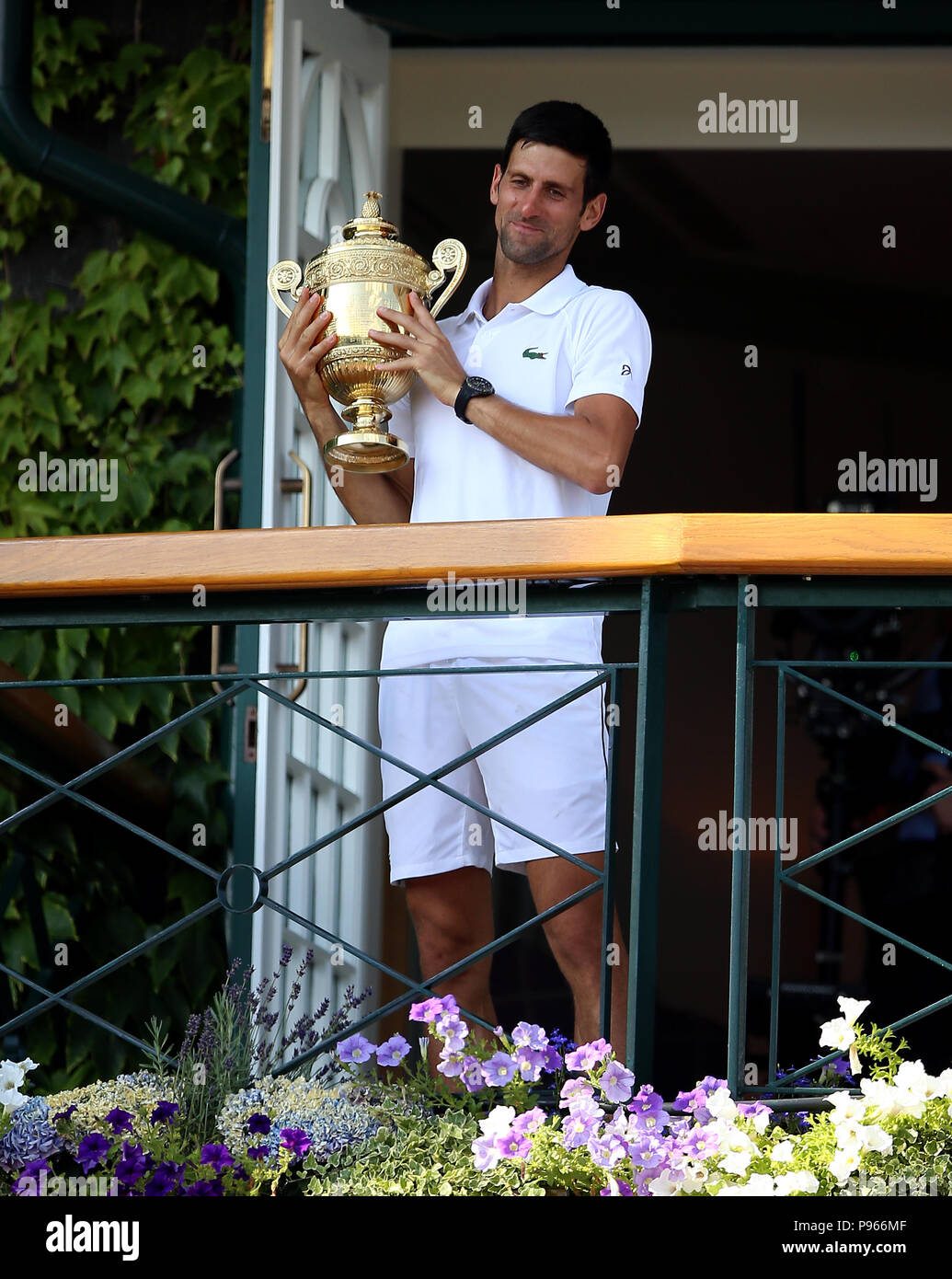 Novak Djokovic with the trophy on a centre court balcony after winning ...