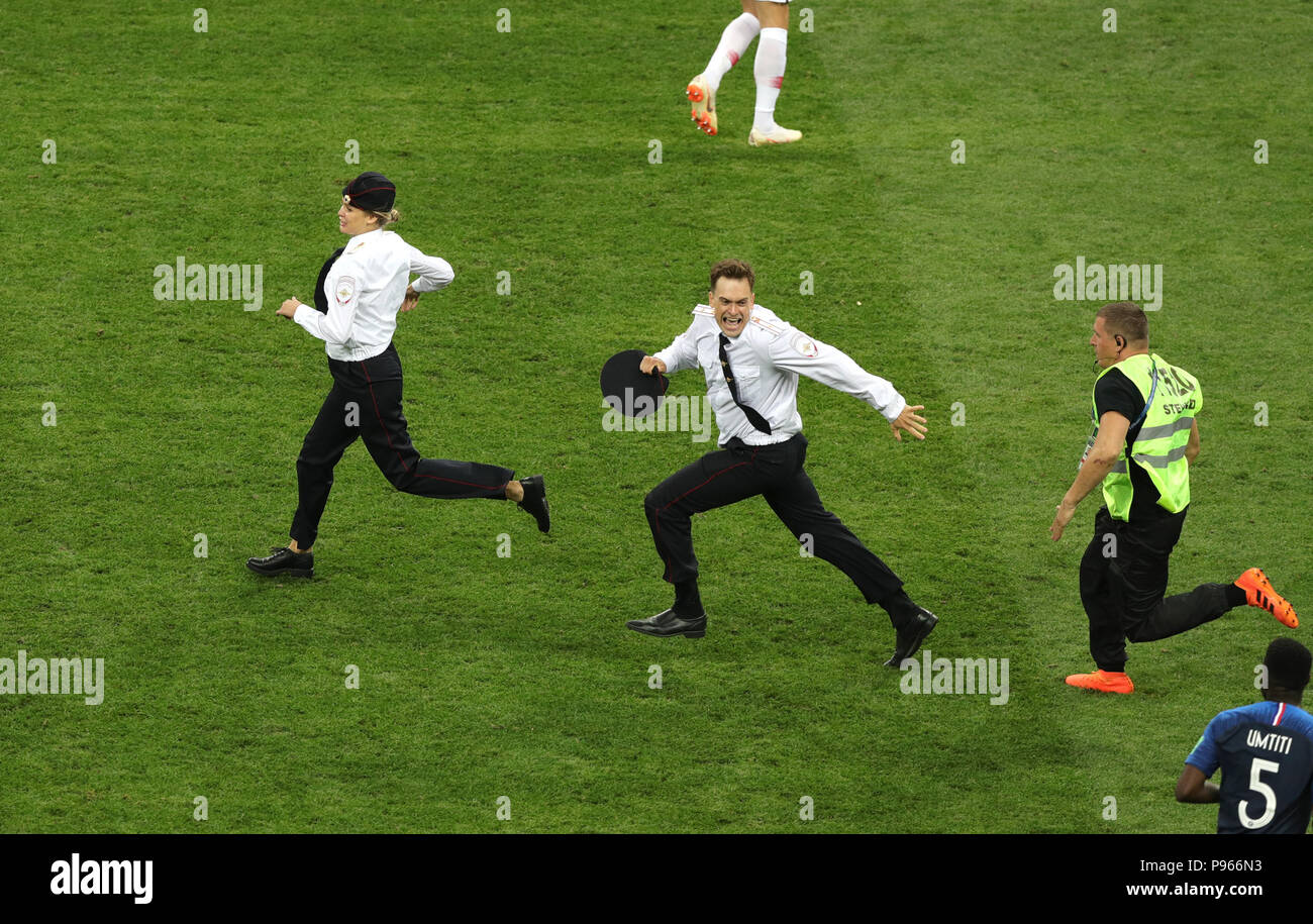 Members of the public are chased by security staff during the FIFA ...