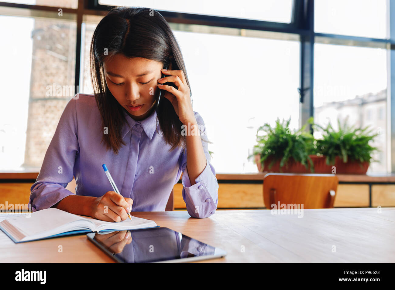 Freelancer taking notes on hi-res stock photography and images - Alamy