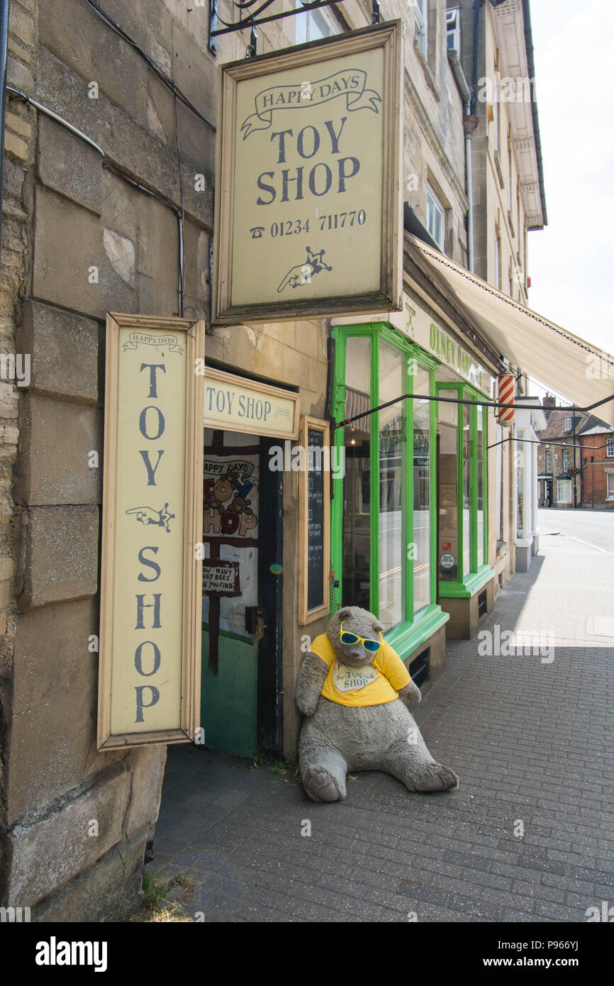 Teddy bear with sunglasses outside a toy shop in Olney Bedfordshire UK ...