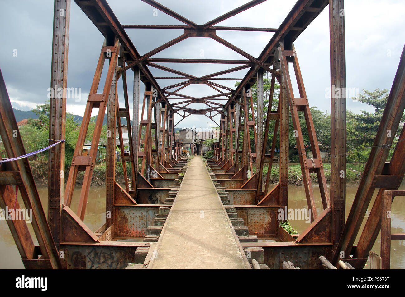 People crossed the unused railway bridge in Baleendah, Bandung ...
