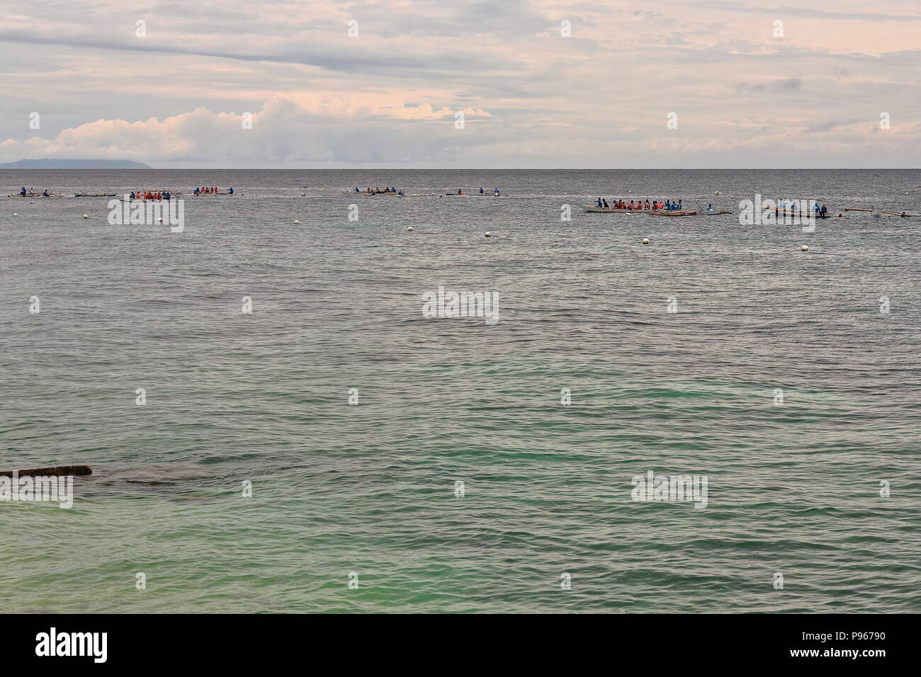 Fishermen in Tan-awan barangay of Oslob city feed whale sharks by hand ...