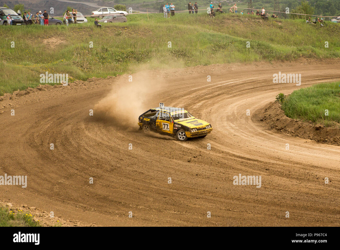 Traditional rally .The racing car drives into a steep turn, scattering ...
