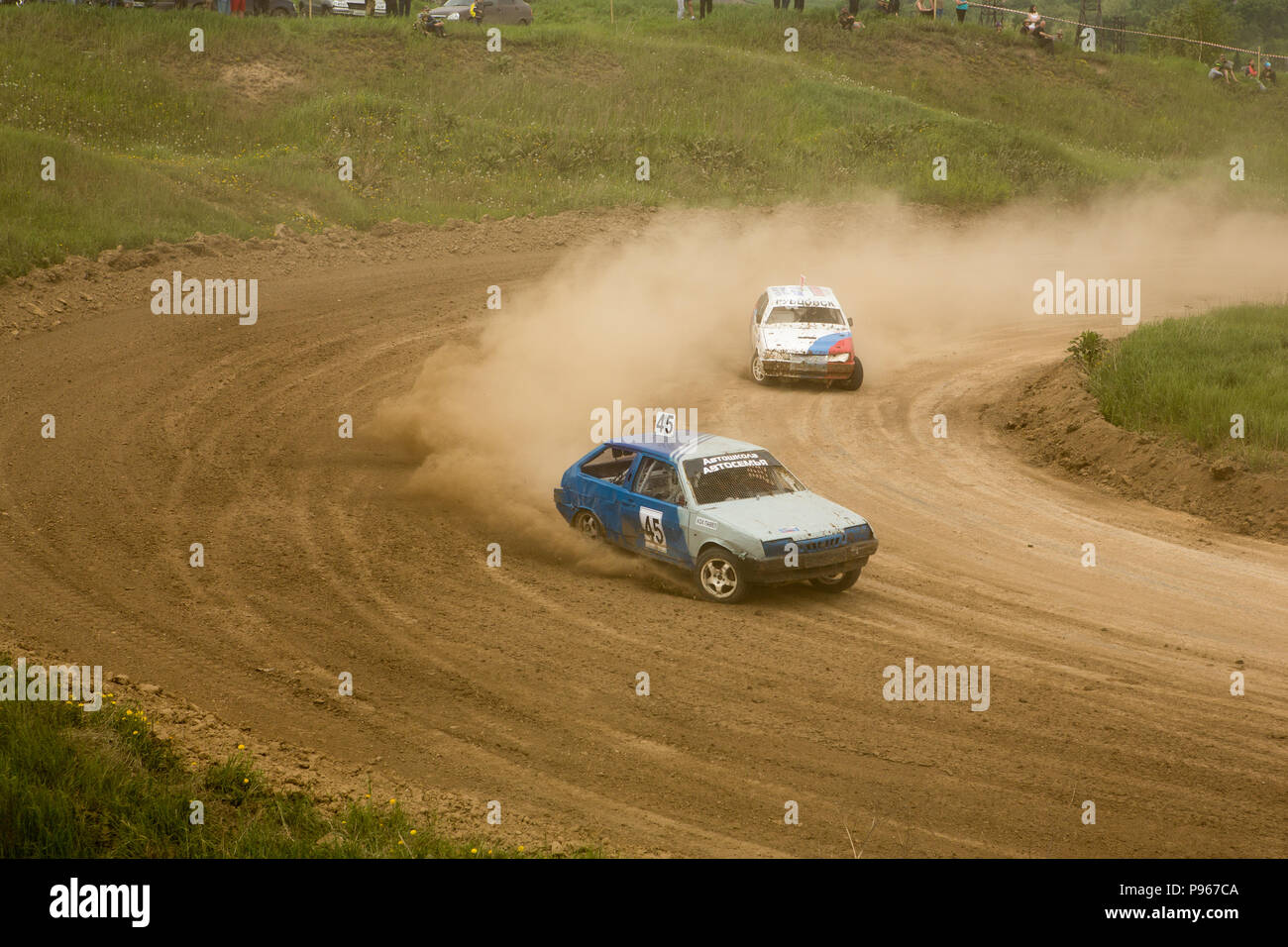 Traditional rally .The racing car drives into a steep turn, scattering ...