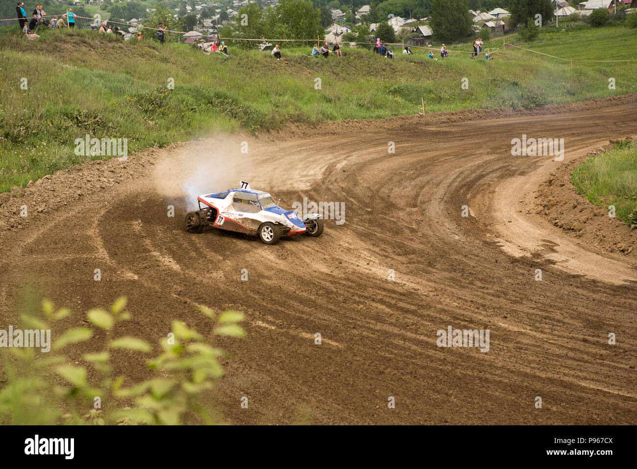 Traditional rally .The racing car drives into a steep turn, scattering ...