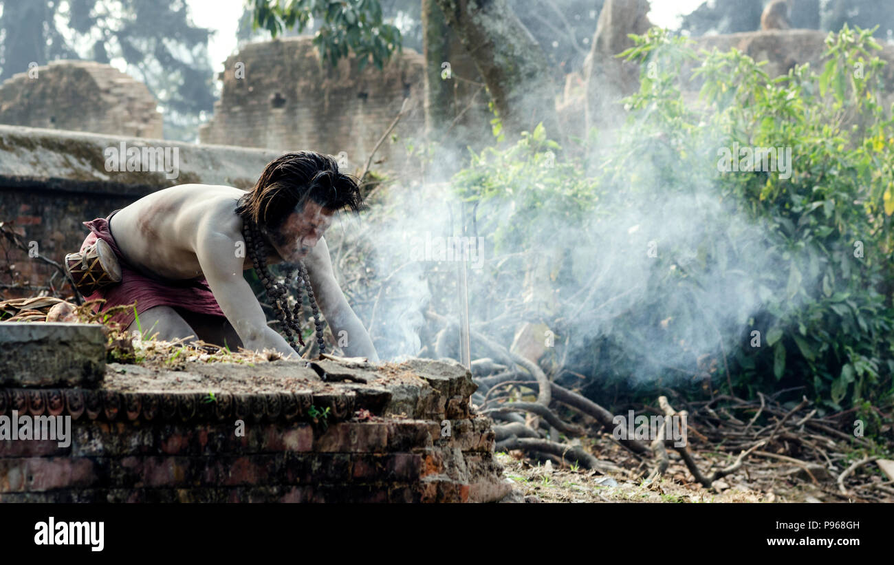Sadhu preparing fire for ritual during the traditional Hindu festival ...