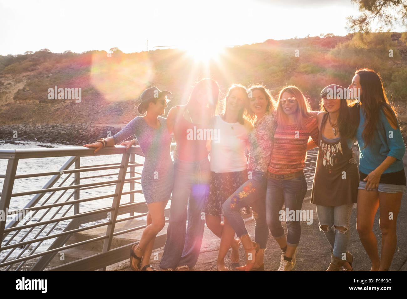 group of seven nice and beautiful caucasian girls young women have fun ...