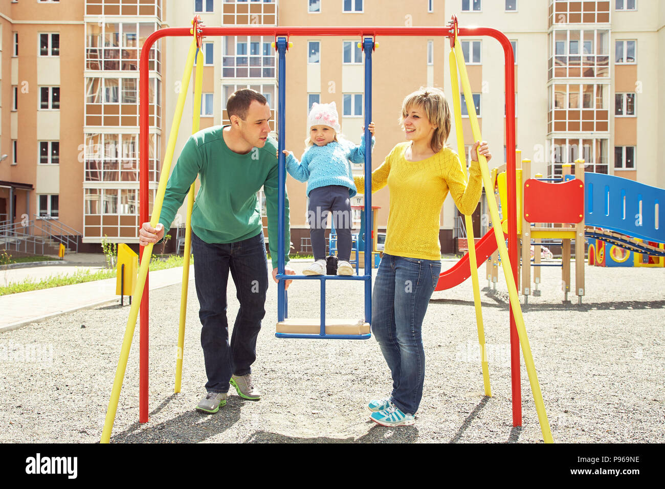 child with parents at the playground Stock Photo - Alamy