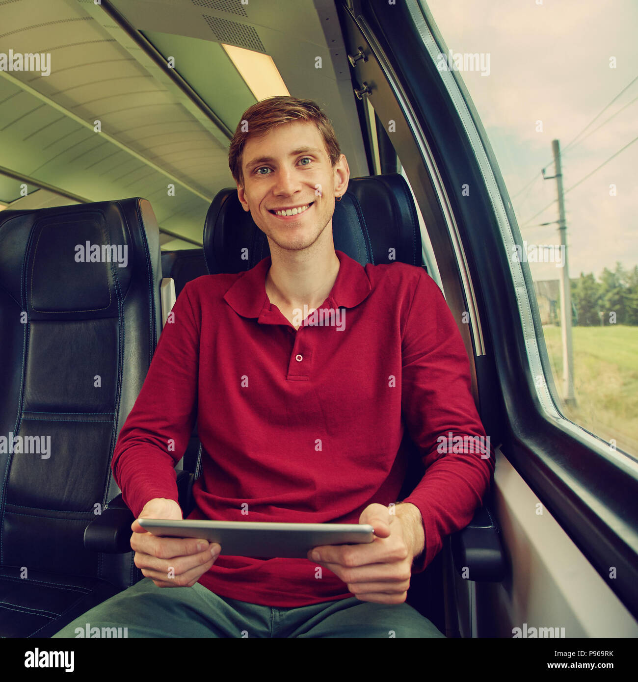 Man on train commuting hi-res stock photography and images - Alamy