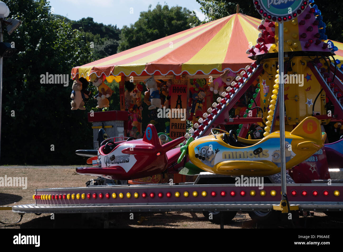 Rides in an amusement park fun fair Stock Photo - Alamy
