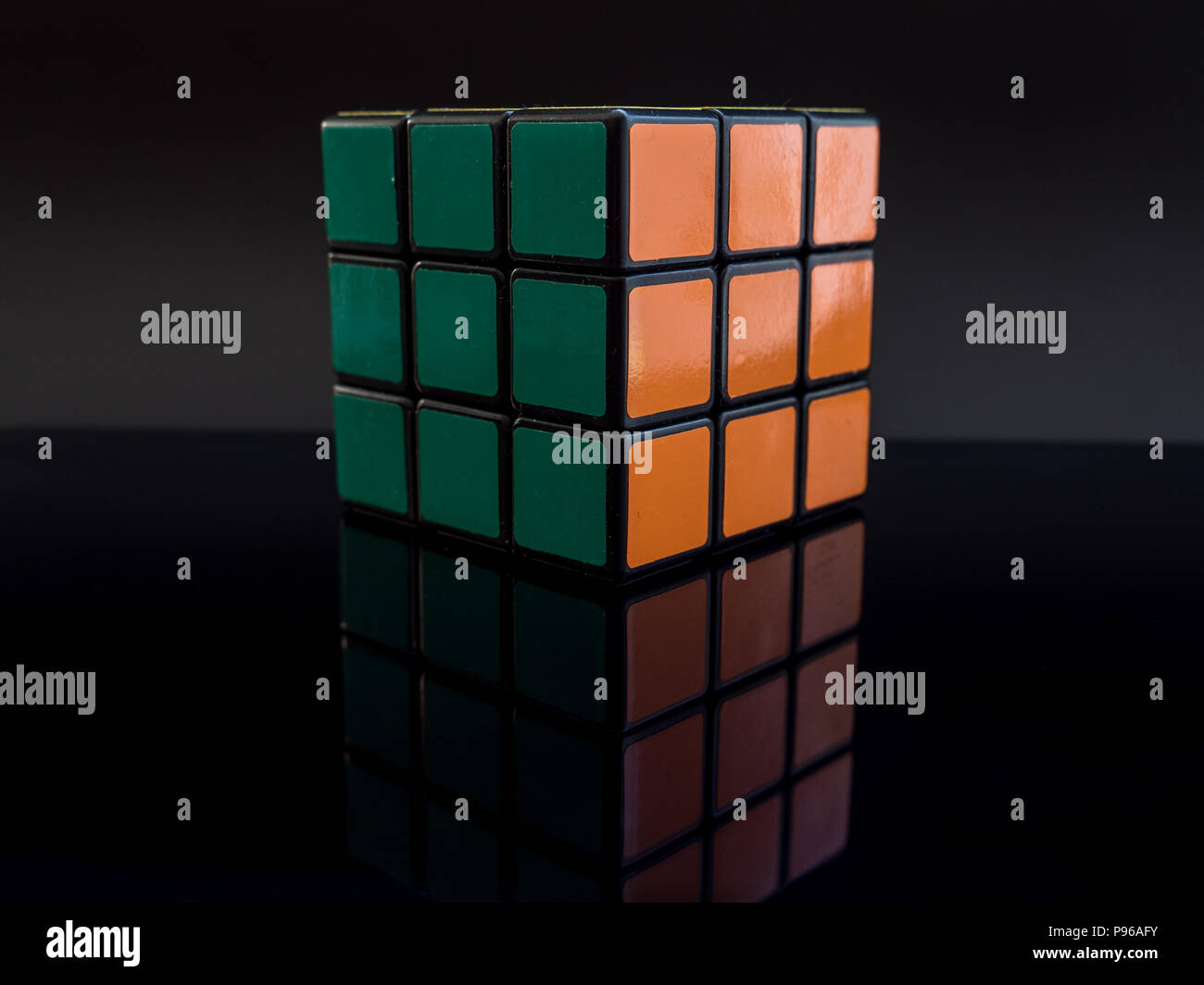rubik's cube on black background with reflection solved studio light ...