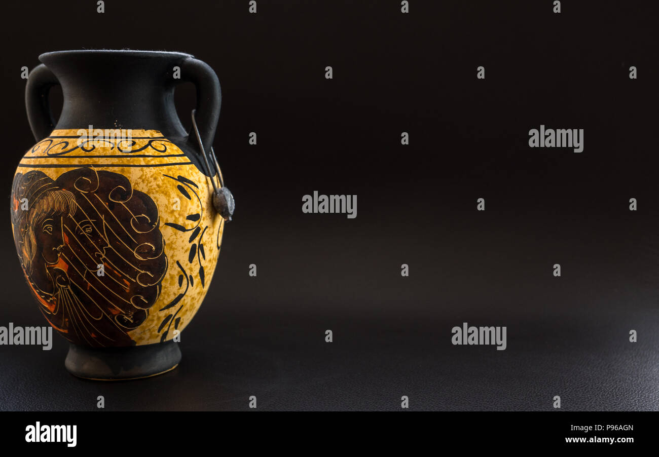 ancient vintage greek vase on black background with space for text ...