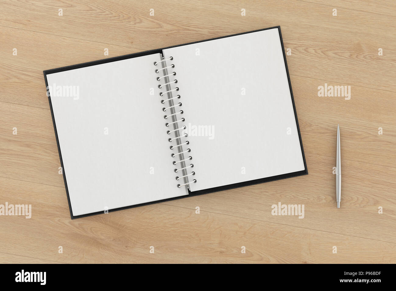Blank facing pages of notebook on a spring with leather cover and ...