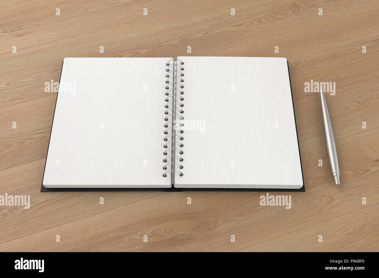 Blank facing pages of notebook on a spring with leather cover and ...