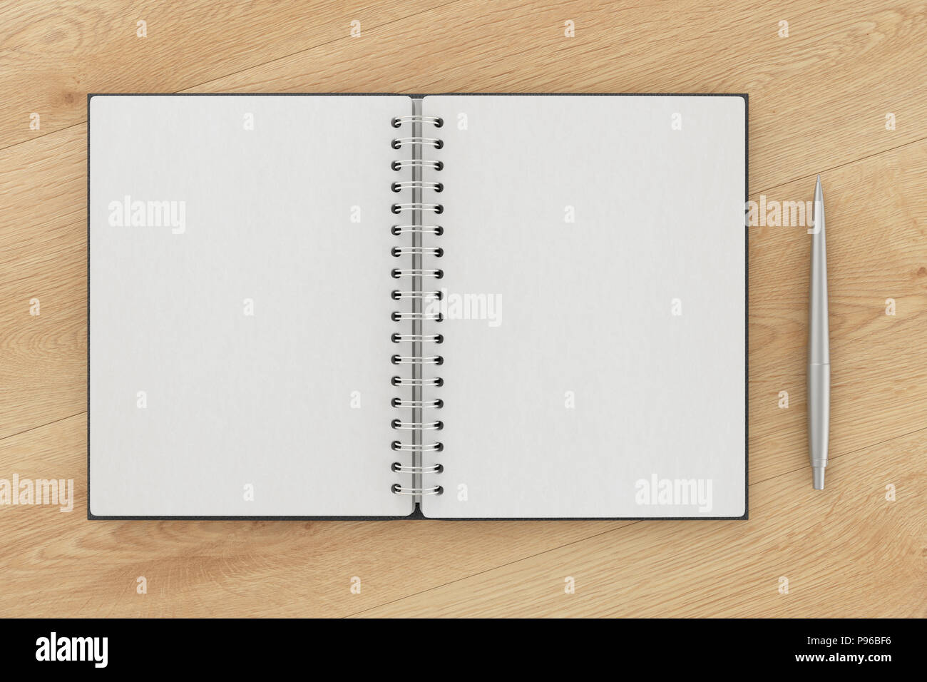 Blank facing pages of notebook on a spring with leather cover and ...