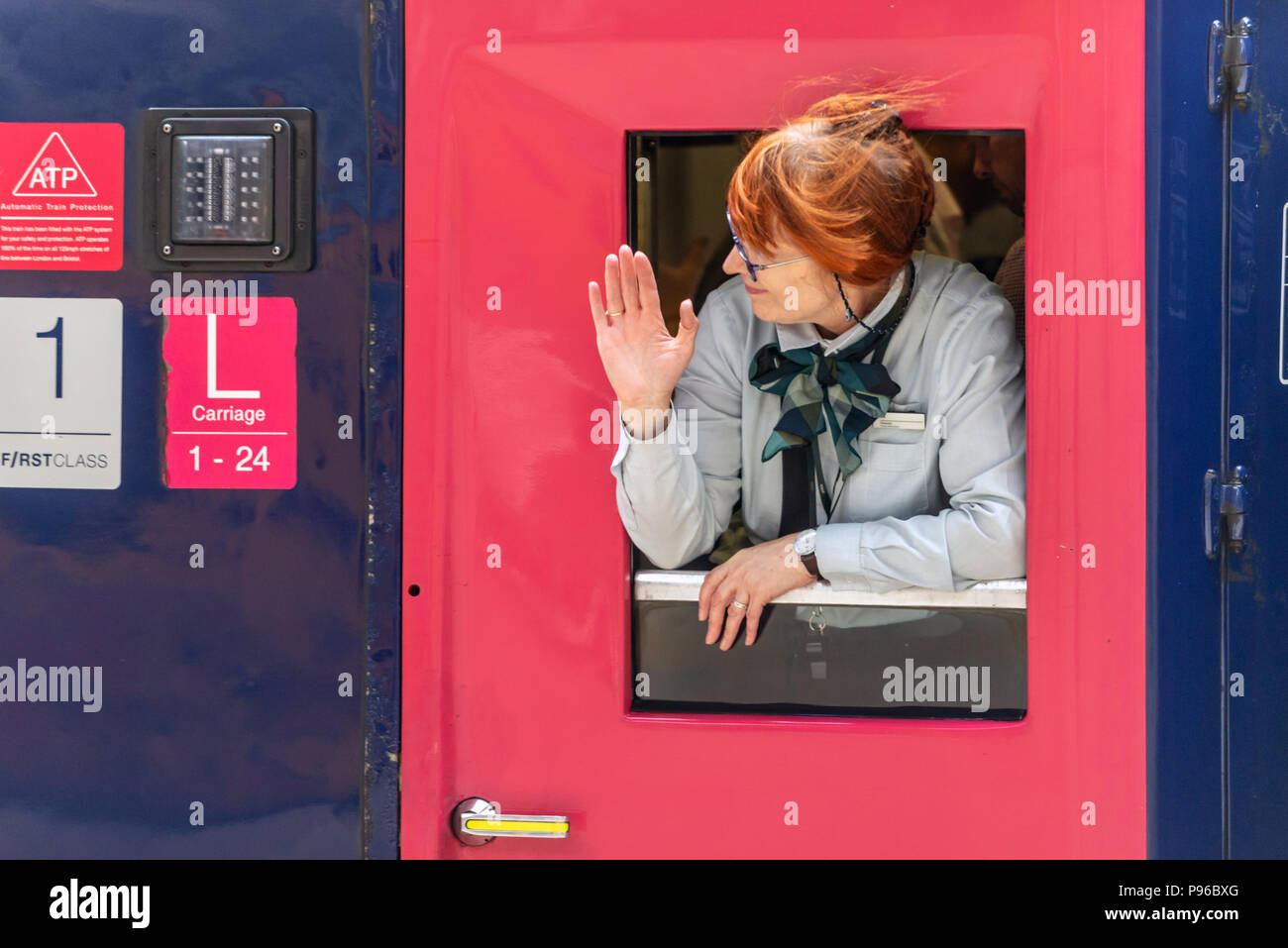 Train conductor at Paddington Station in London Stock Photo - Alamy