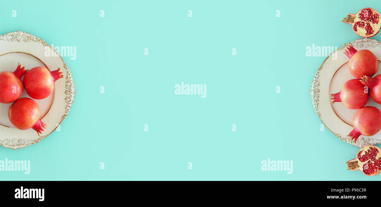 Rosh hashanah (jewish New Year holiday) concept. Pomegranate raditional ...