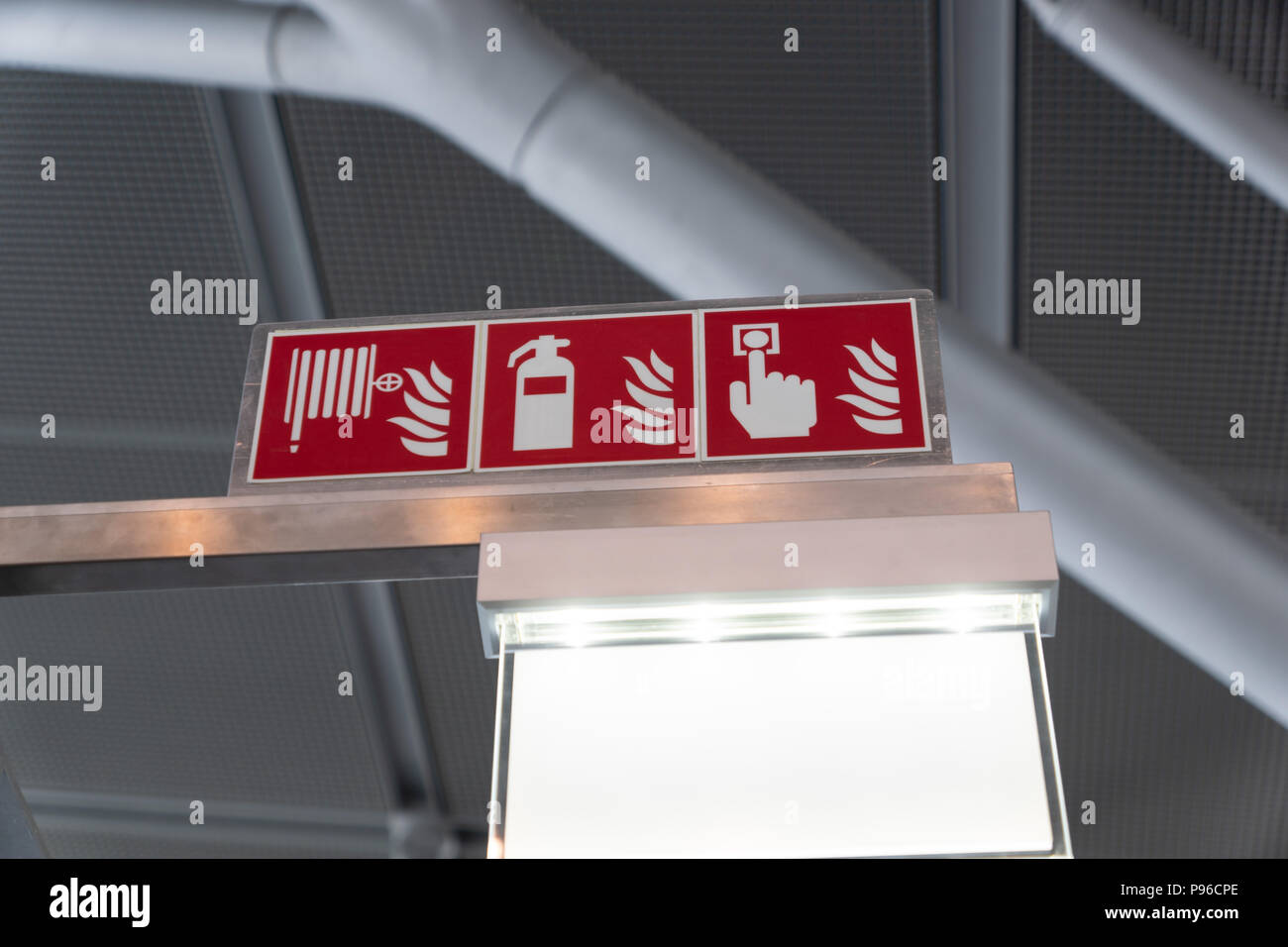 Symbols with fire extinguishers, fire hose and fire alarm key at a ...