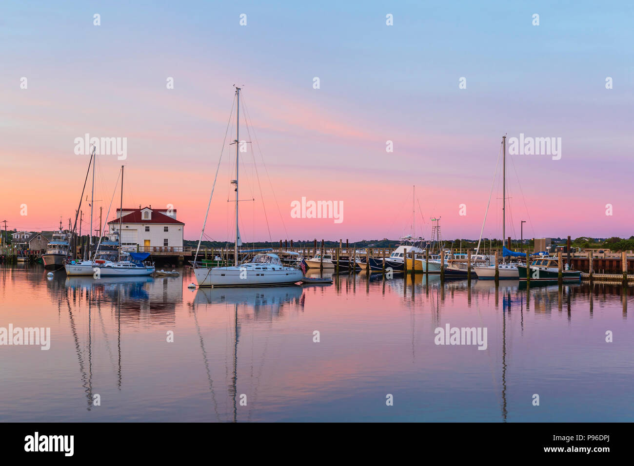 Boats docked in Menemsha Basin under a pre-sunrise sky, in the fishing ...