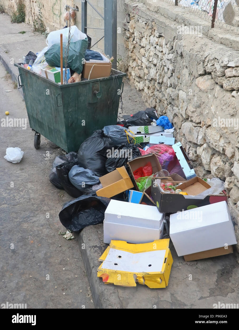 Large pile of garbage next to full container on filthy street Stock ...