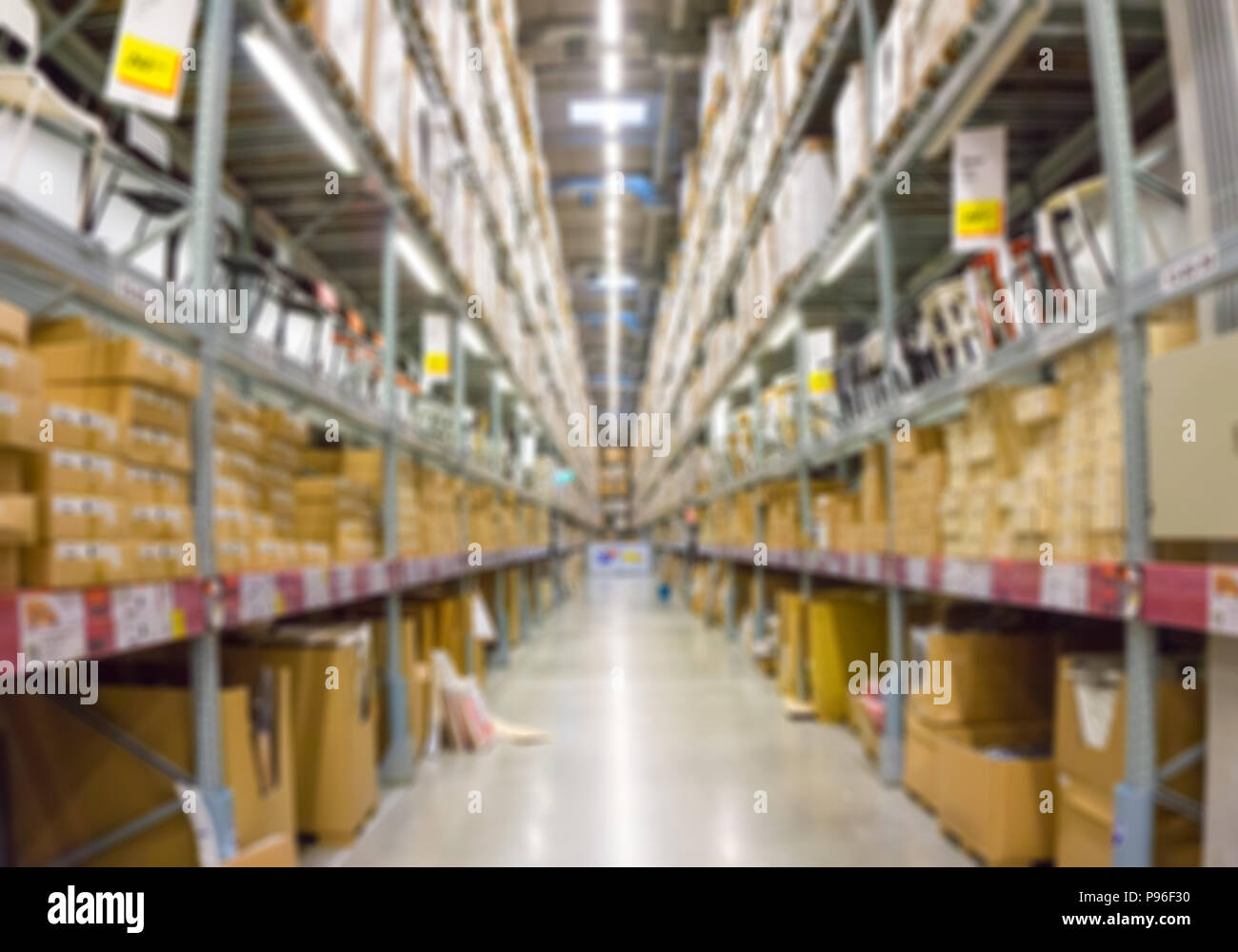 Blur image of a warehouse with multi layer shelves Stock Photo - Alamy