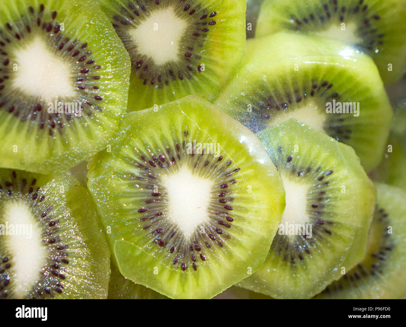 Many green kiwi fruit slices in transparent plastic Stock Photo - Alamy