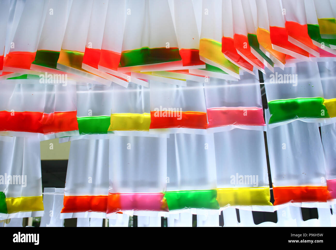 colorful water in plastic bag, for background Stock Photo - Alamy